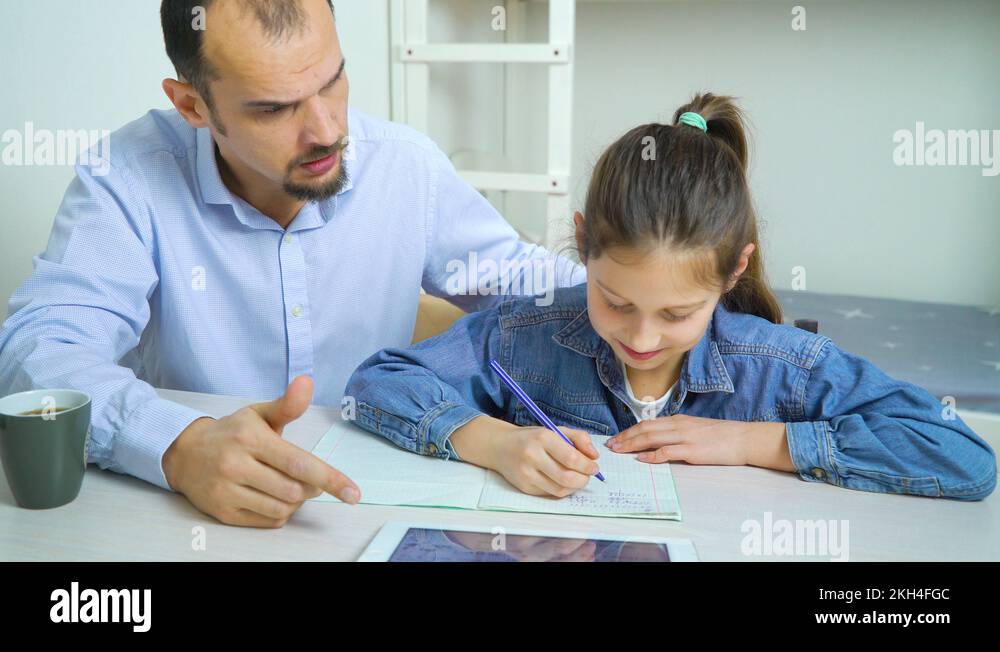 angry father is annoyed with his daughter doing homework Stock Video ...