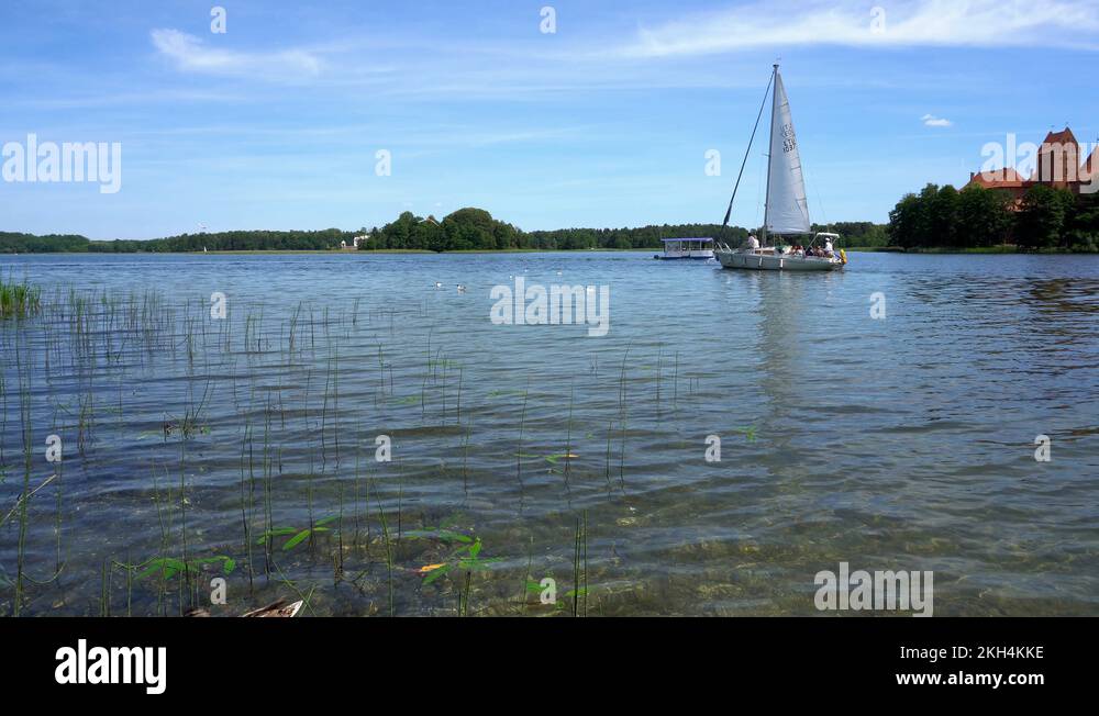 Yacht,catamaran,and motor boat float on lake water. Gimbal panorama ...