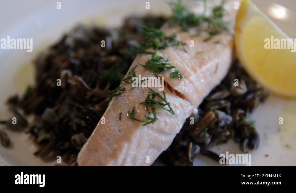 steamed red fish, served with black rice and lemon. high protein foods ...