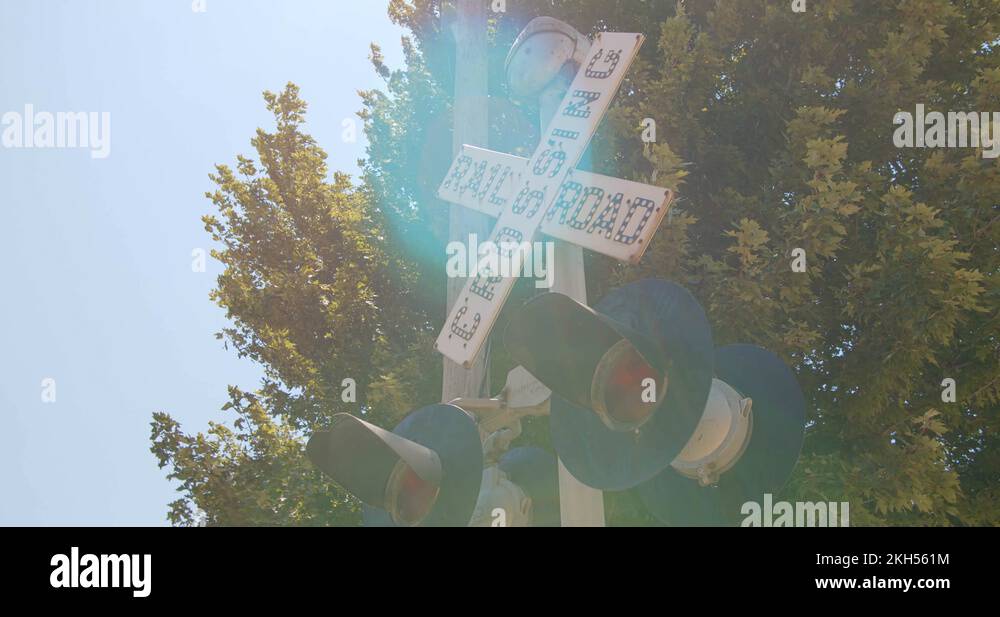 Railroad Crossing Sign, Slow Motion 4K Sun Lens Flare Stock Video ...