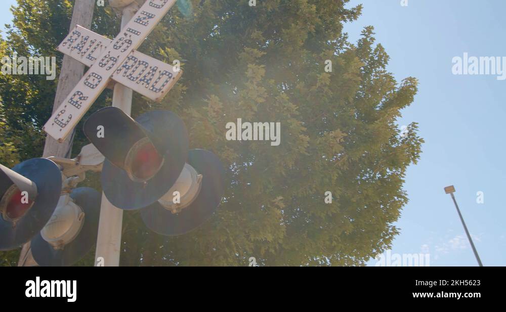 Railroad Crossing Sign, Slow Motion 4K Sun Lens Flare Stock Video ...