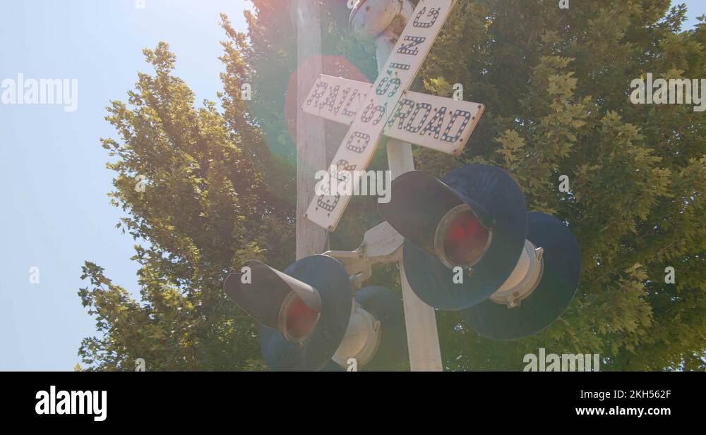 Railroad Crossing Sign, Slow Motion 4K Sun Lens Flare Stock Video ...