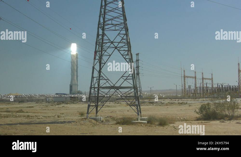 Driving along a solar tower station in the Israeli Negev desert ...