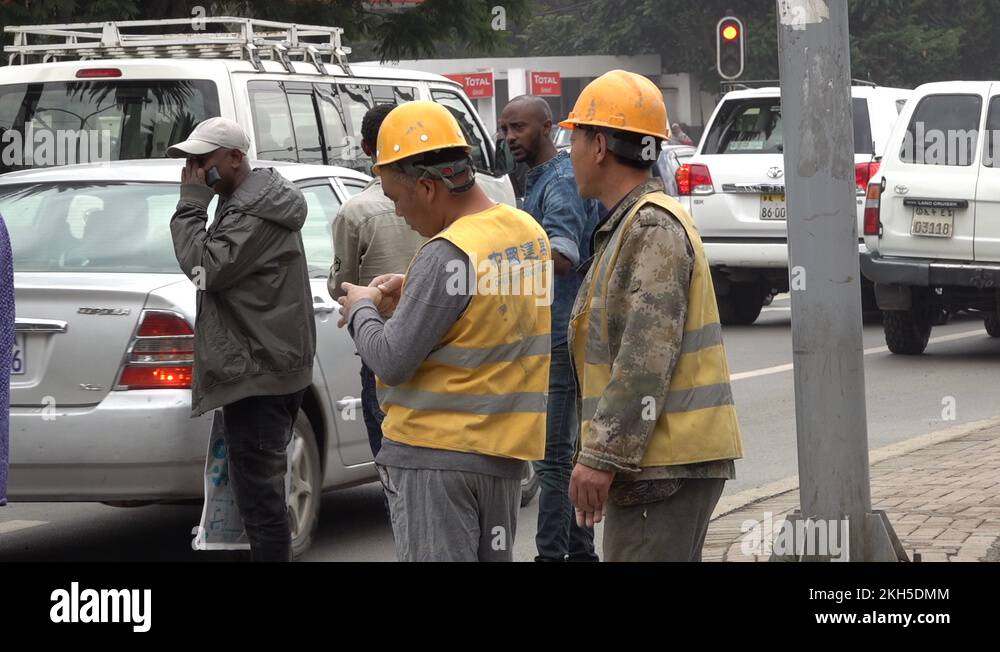 China in Africa - Chinese construction workers cross road Addis Ababa ...