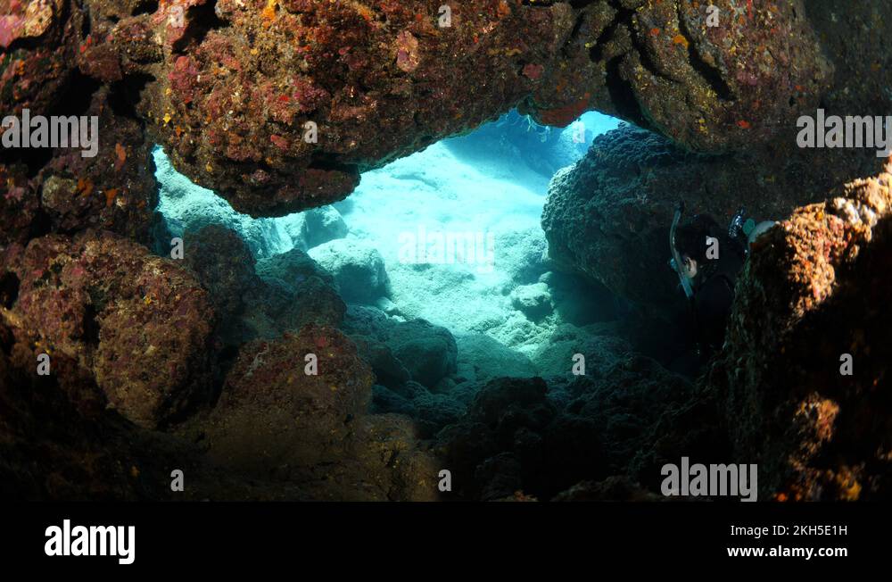 cave diving underwater scuba divers exploring cave dive caverns tunnels ...