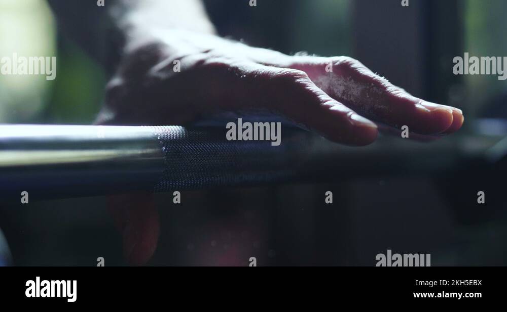 A professional young kickboxer with fit body is making a routine ...