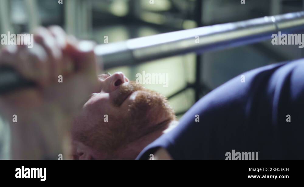 A professional young kickboxer with fit body is making a routine ...