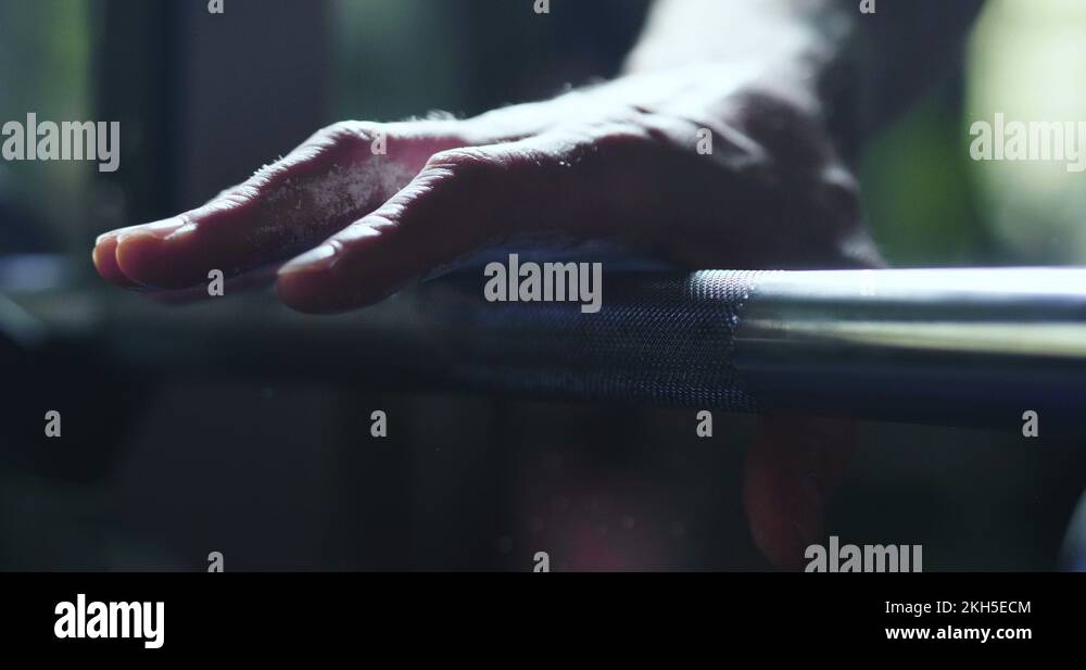 A professional young kickboxer with fit body is making a routine ...