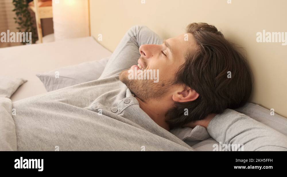 Man relaxing in bed Stock Videos & Footage - HD and 4K Video Clips - Alamy