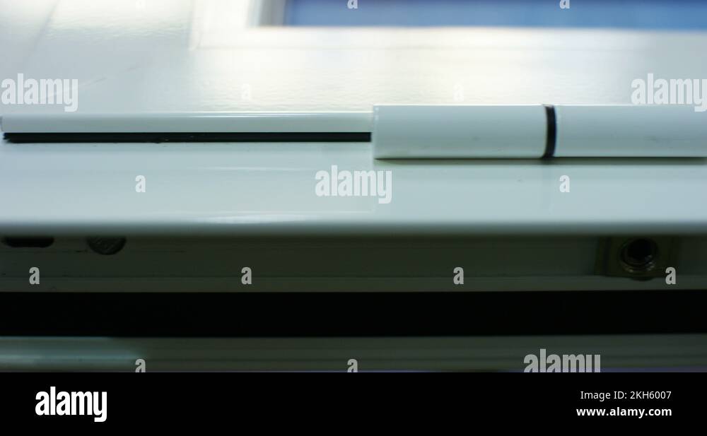 Macro of a window frame or door with the details on the handles or on ...