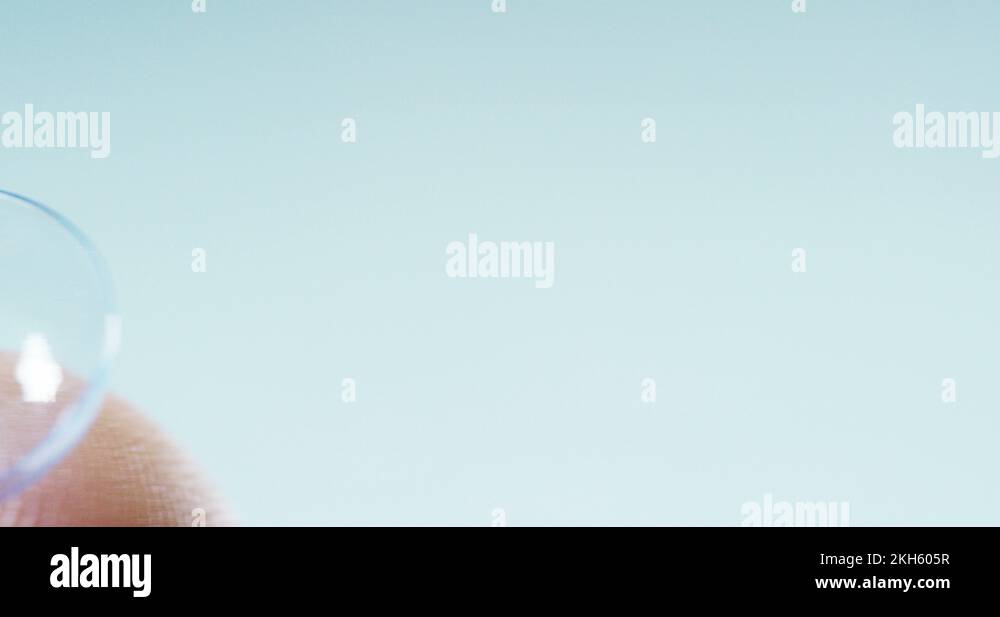 Macro of finger holding contact lens technology with a chip to see ...