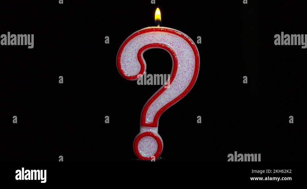 Candle of shape of question mark blown off Stock Video Footage - Alamy