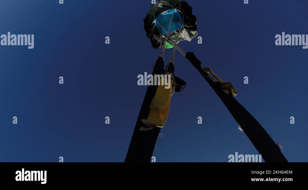 Men with a woolen suit knock out of a plane in the void and fly in the ...