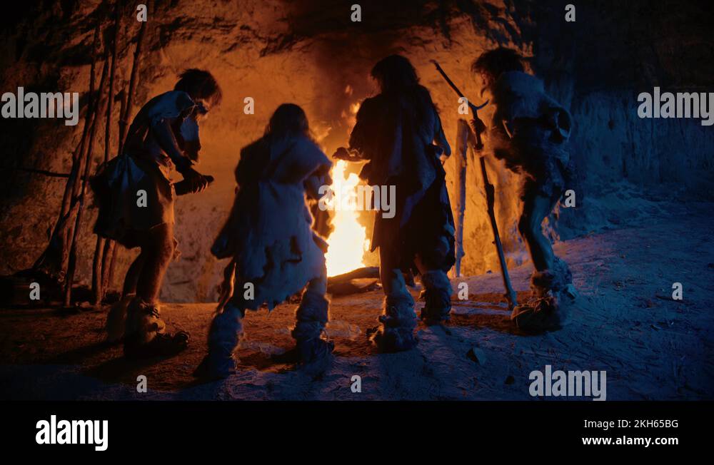 Tribe of Prehistoric Hunter-Gatherers Wearing Animal Skins Dance Around ...