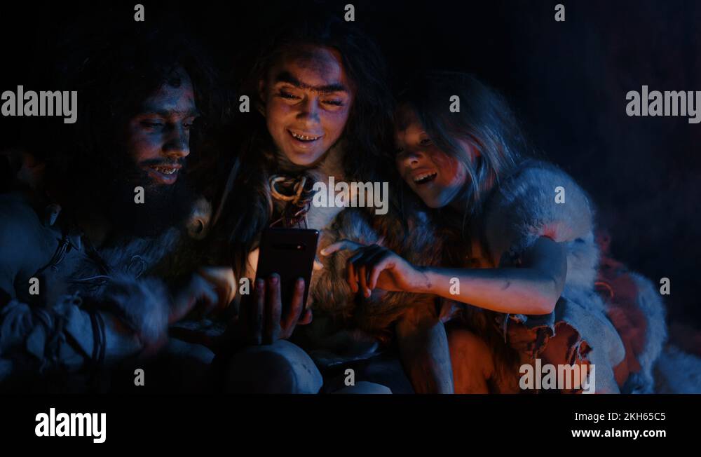 Tribe of Prehistoric, Primitive Hunter-Gatherers Wearing Skins Use ...