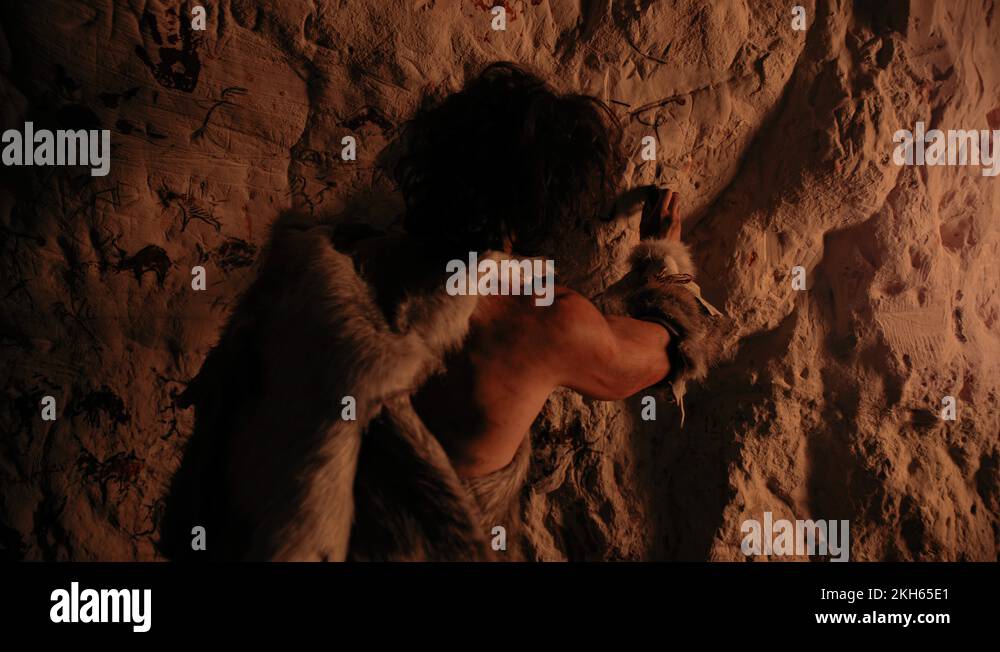Primitive Prehistoric Neanderthal Wearing Animal Skin Draws Animals and ...