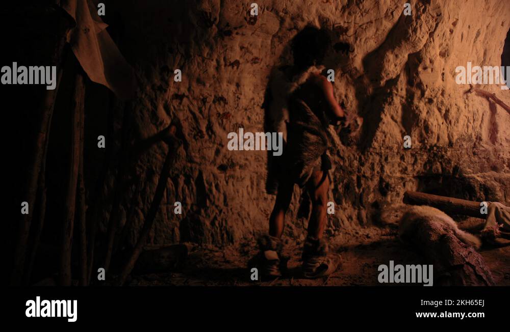 Primitive Prehistoric Neanderthal Wearing Animal Skin Draws Animals on ...