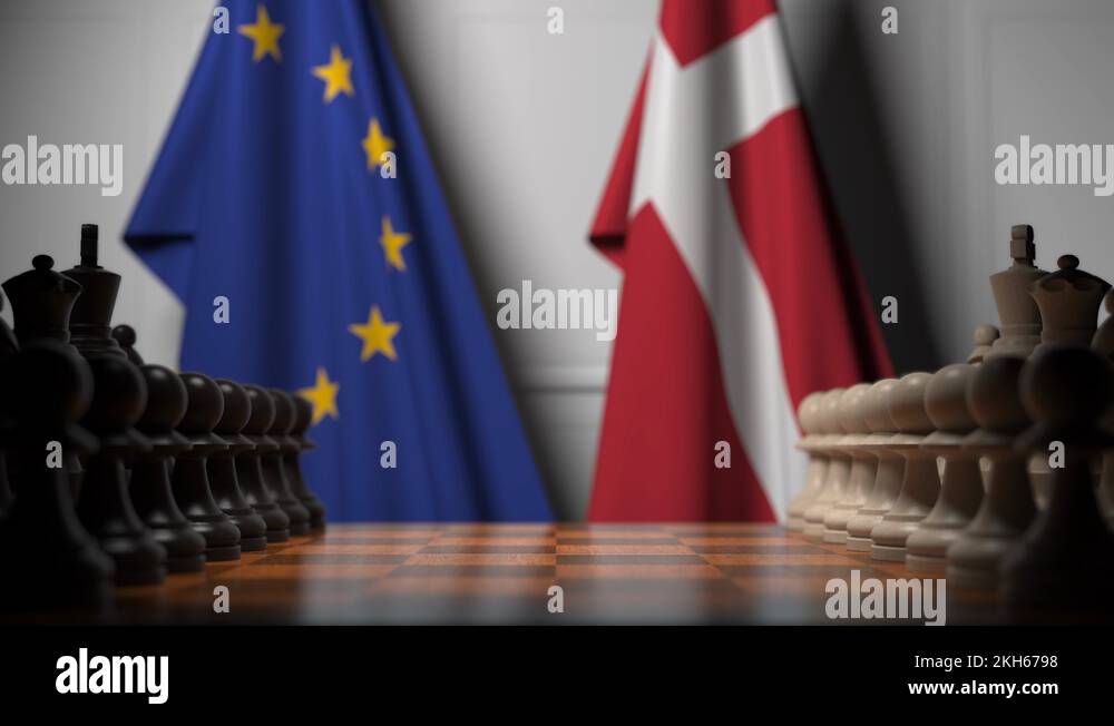 Flags of the EU and Denmark behind chess board. The first pawn moves in ...
