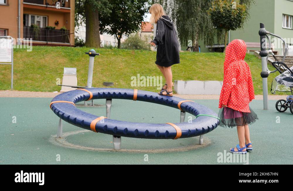 Children boys and girls have fun balancing playing try to stay on ...