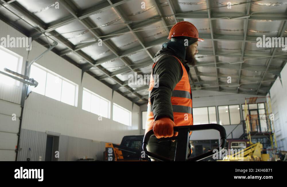 Garage worker is rolling tire. A platform truck is simply a large ...