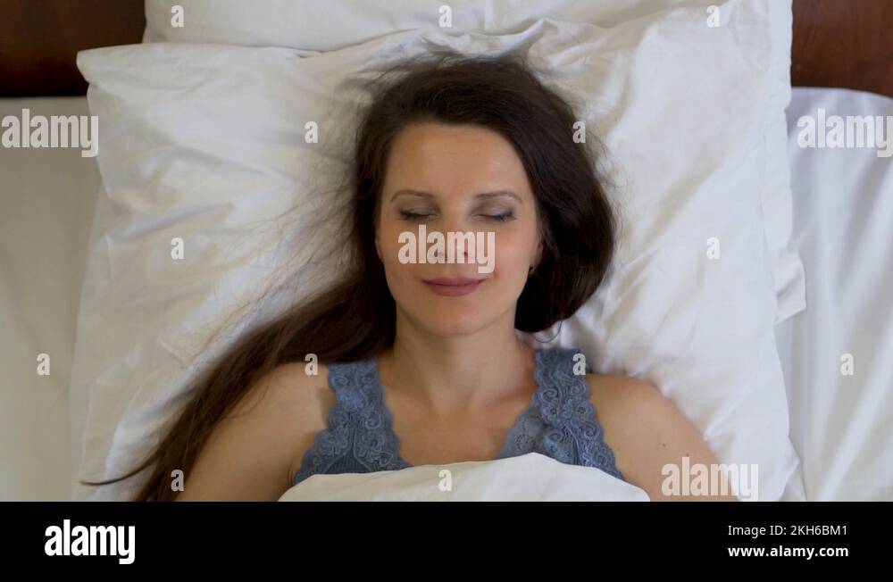Closeup face woman sleeping sweetly in the morning in bed with white ...