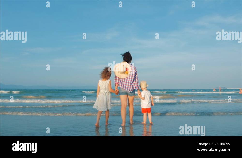 Happy family standing on a beach Stock Videos & Footage - HD and 4K ...