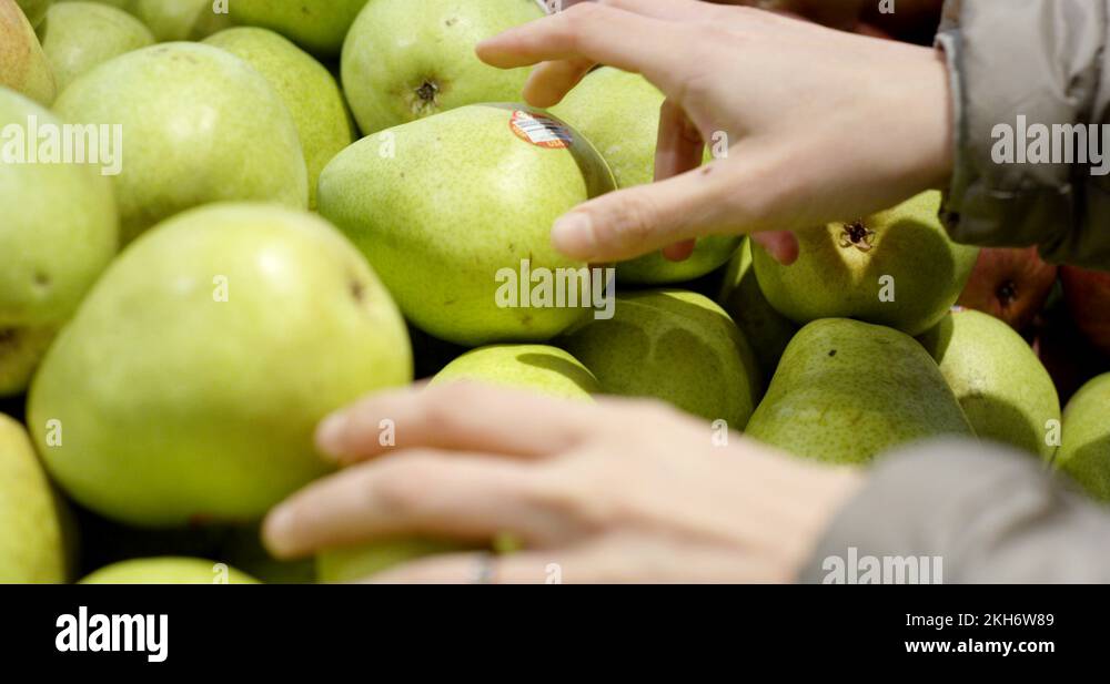 woman hands squeezing pears in grocery store fruit strand Stock Video ...