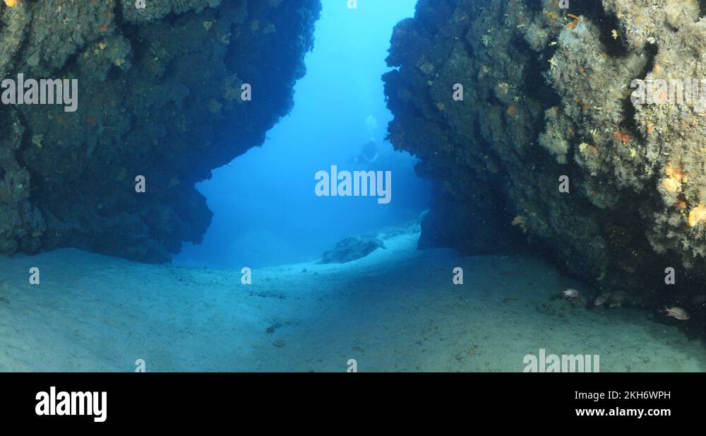 cave diving underwater scuba divers exploring cave dive caverns tunnels ...