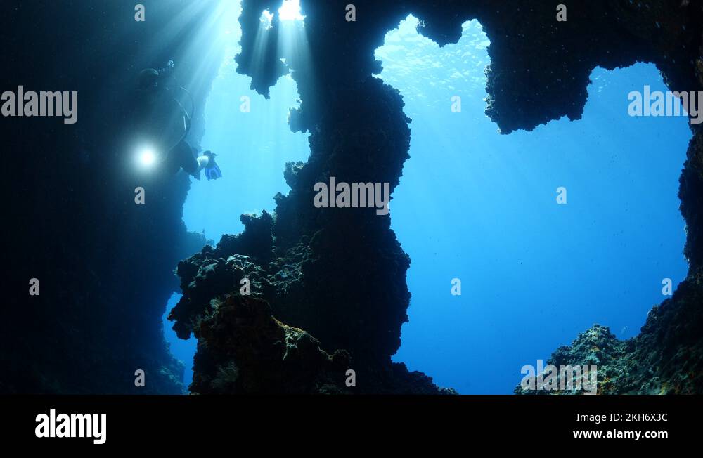 cave diving underwater scuba divers exploring cave dive caverns tunnels ...