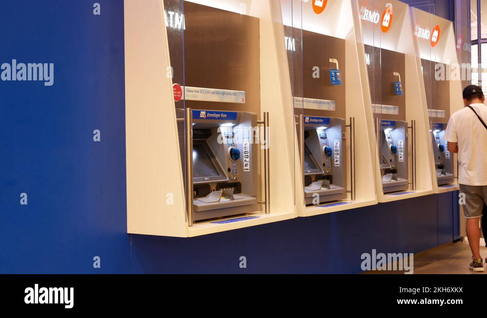 Motion of people withdraw money at ATM machine inside Burnaby shopping ...