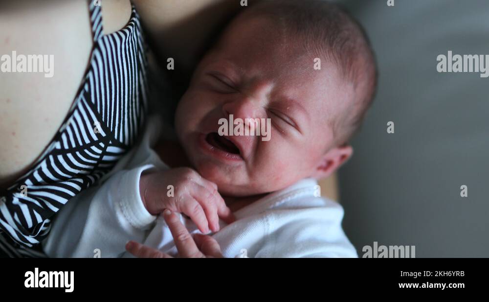 Newborn baby crying in mother arm Stock Video Footage - Alamy