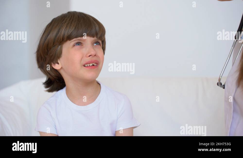 Portrait of child cute little boy afraid of injection. Doctor nurse ...