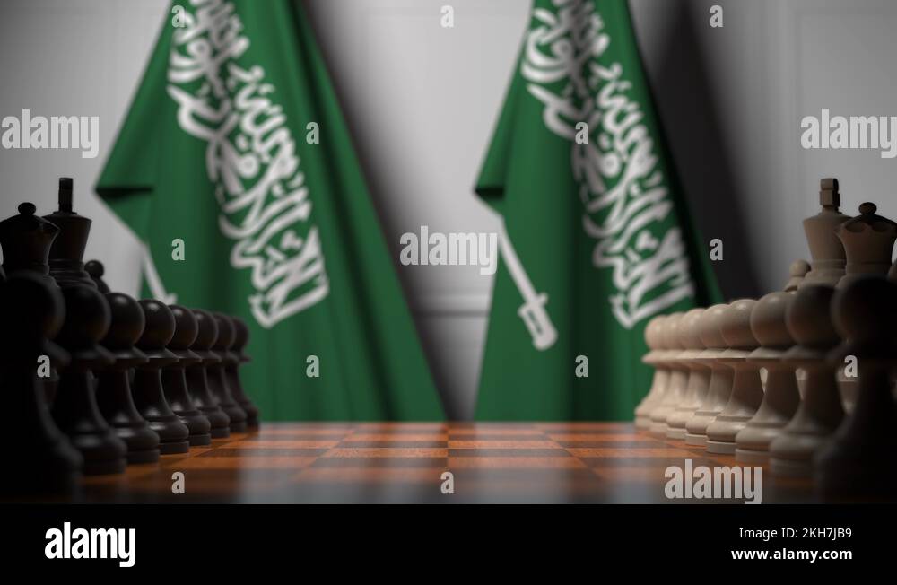 Chess game against flags of Saudi Arabia. Political competition related ...
