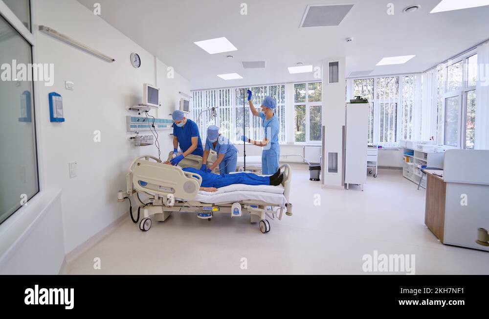 Spacious emergency room in the new hospital. Doctors give resuscitation ...