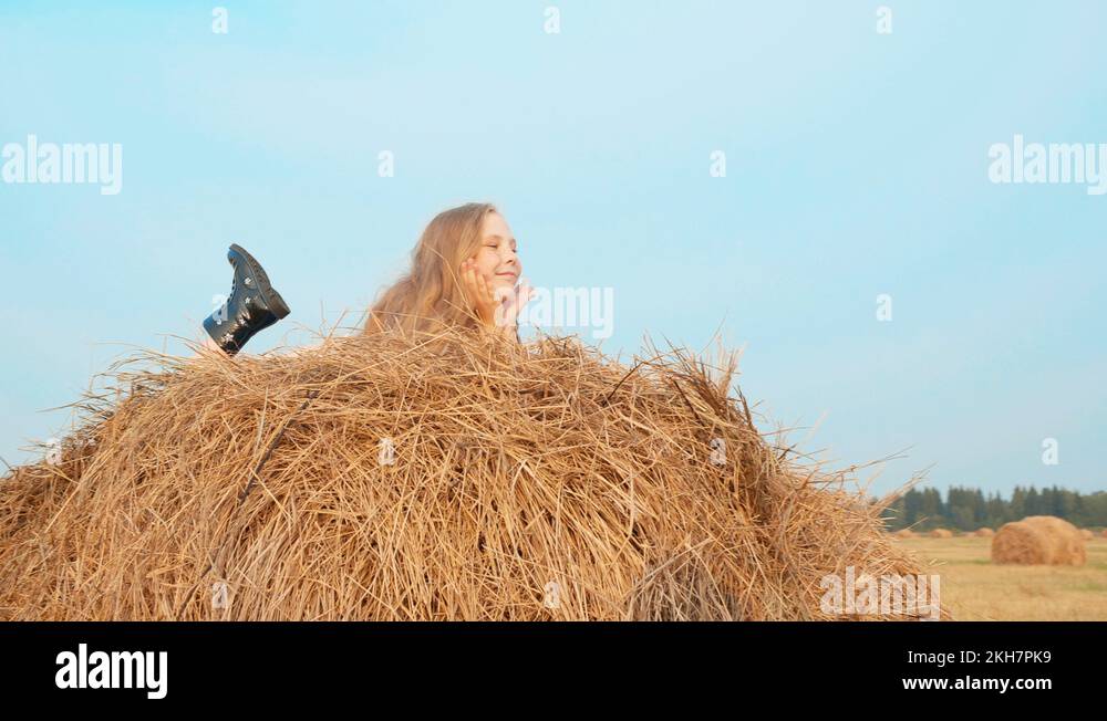 Girl lying on haystack Stock Videos & Footage - HD and 4K Video Clips ...