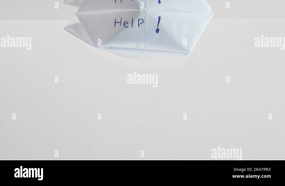 Sinking folded paper boat into the water. Mental state and Emotional ...
