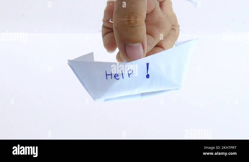 Sinking folded paper boat into the water. Mental state and Emotional ...