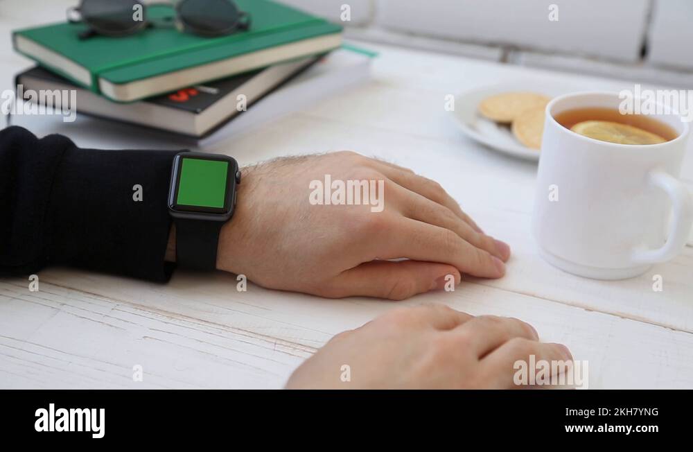 Close up of Male Hands Touching and Tapping Smart Watch with Green ...
