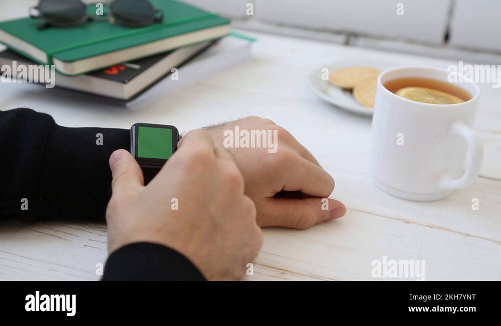 Close up of Male Hands Touching and Tapping Smart Watch with Green ...