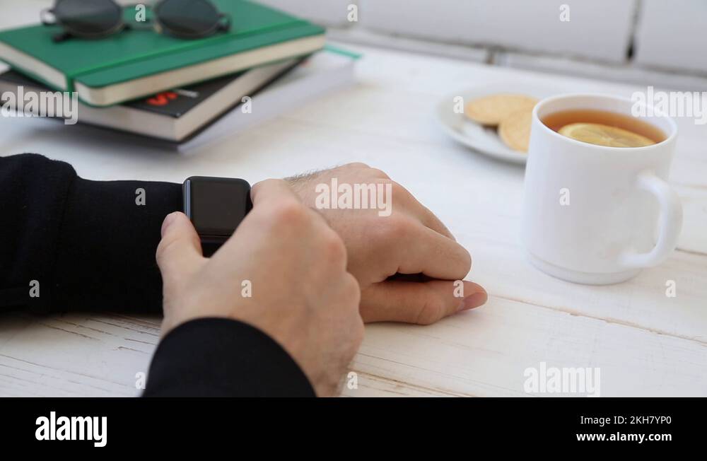 Close up of Male Hands Touching and Tapping Smart Watch with Green ...