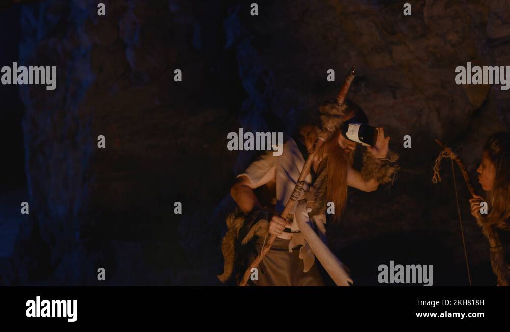 Ancient savage human tribe using modern VR headset technology device ...