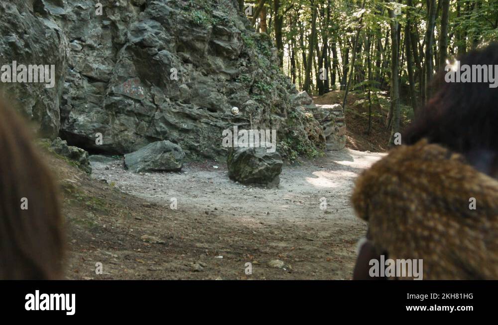 Wild neanderthals hunting in group chasing large mammoth for animal ...