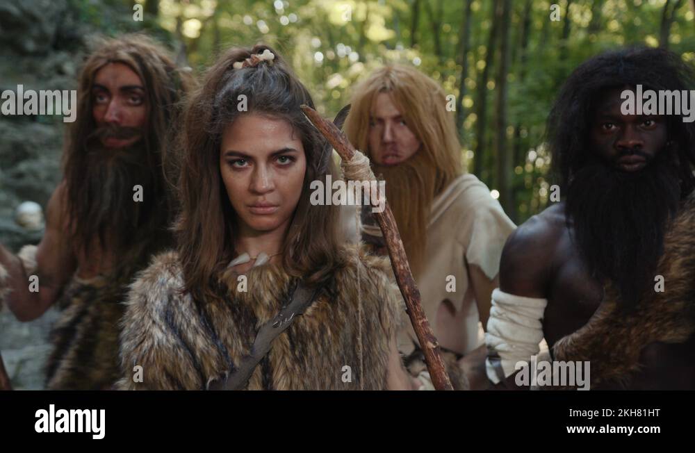 Primitive aboriginal tribe with female archer leader looking ...