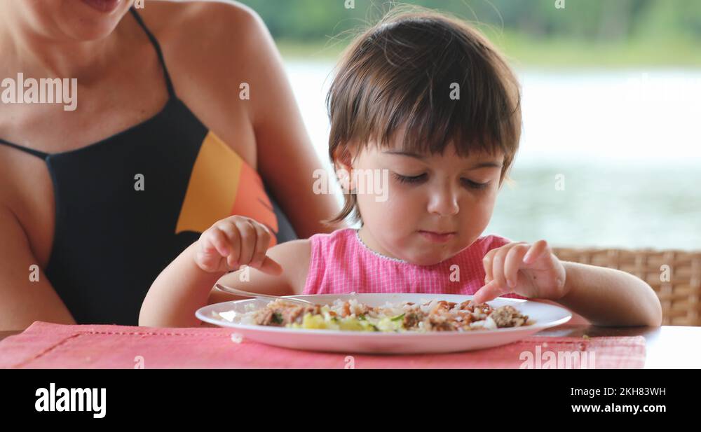 Little girl playing with food, child touching food Stock Video Footage ...
