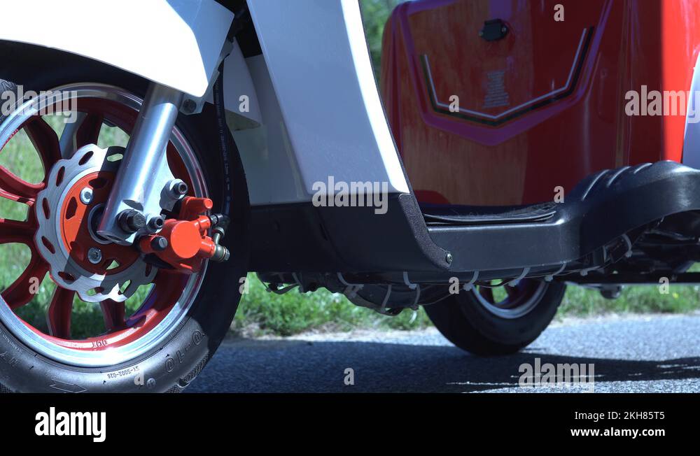 Female walking and stepping to electric scooter bottom and starting a ride in Stock Video ...