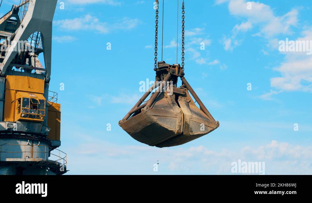 Mechanical bucket opens and rubble is falling from it Stock Video ...