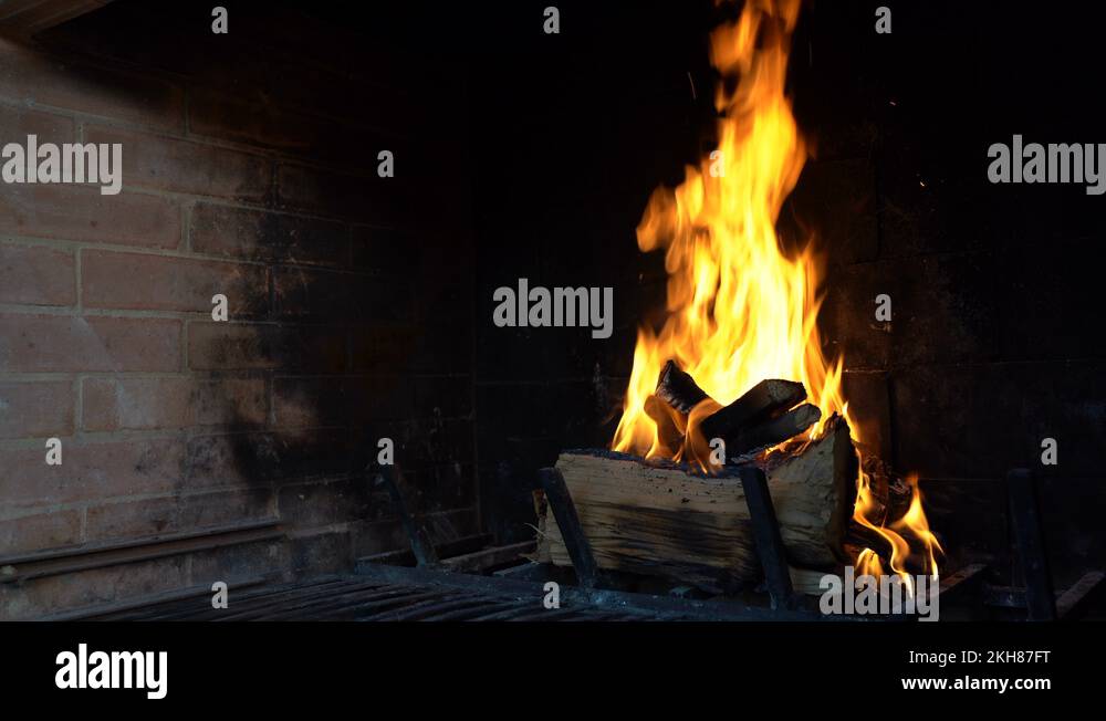 Burning fire in brick fireplace. Fire flames igniting and burning Stock ...