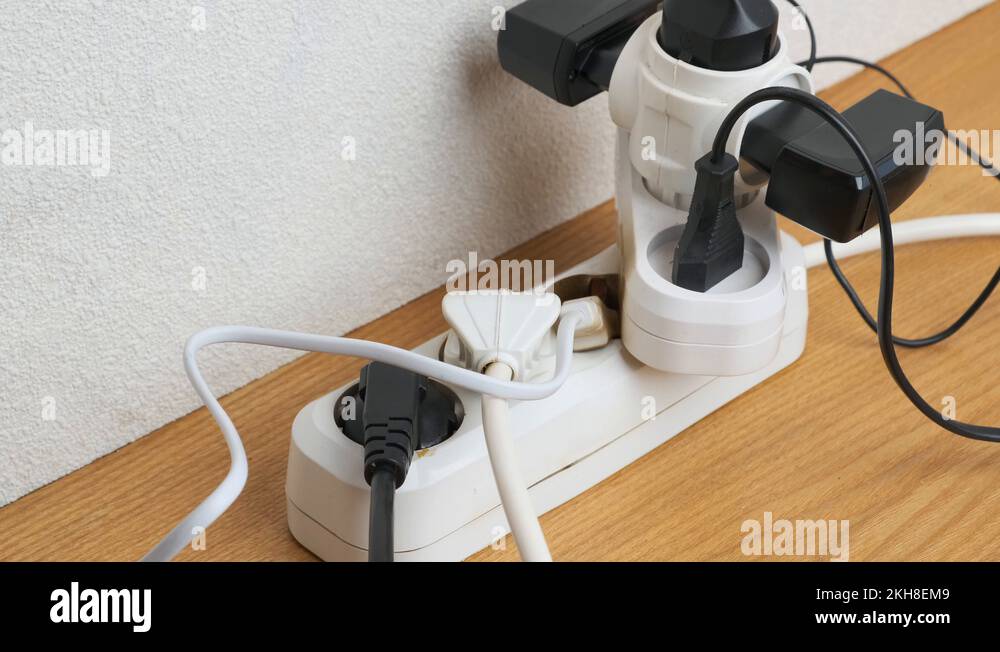 Ignition of overloaded power strip on desk in office Stock Video ...