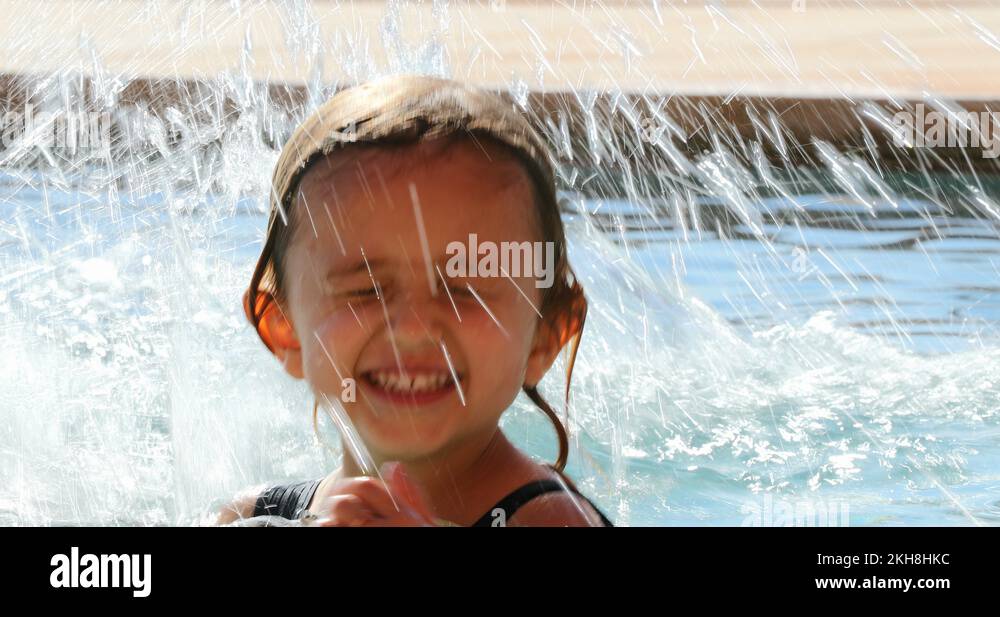 Little girl child at the swimming pool water splashing Stock Video ...