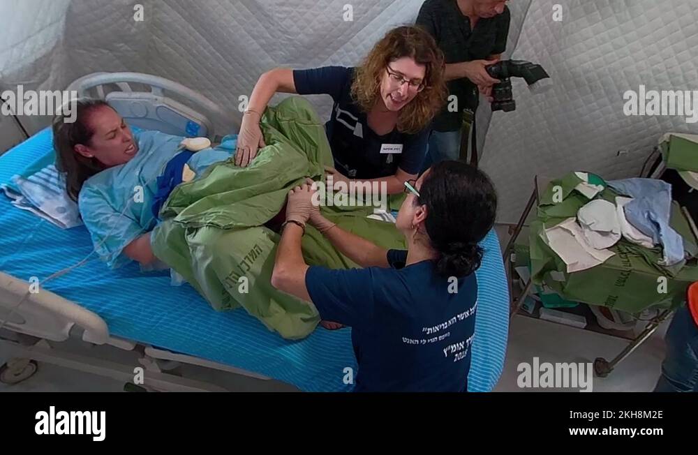 A woman giving birth in field hospital during National Earthquake Drill ...